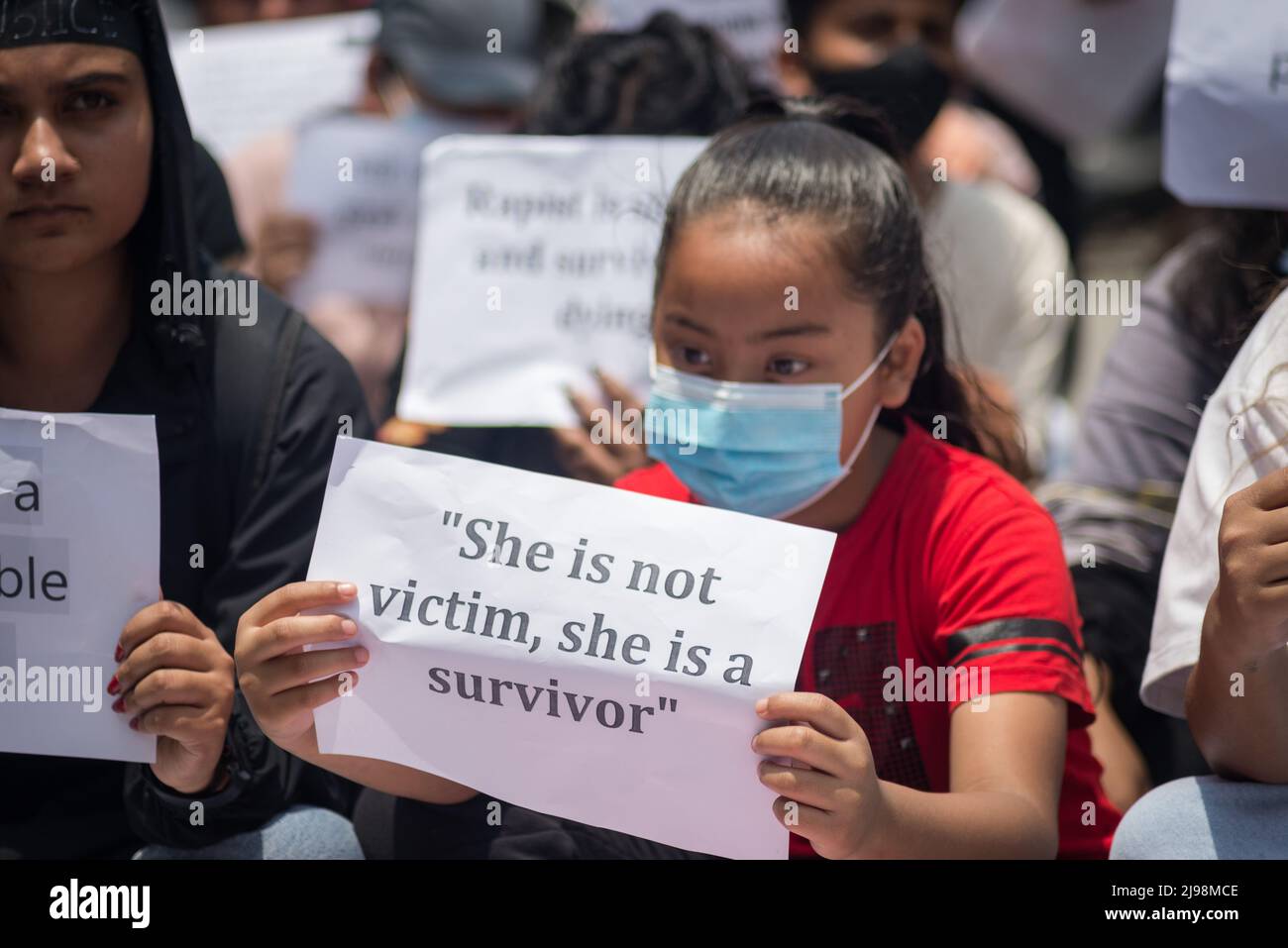 A little child holds a placard expressing her opinion during the ...