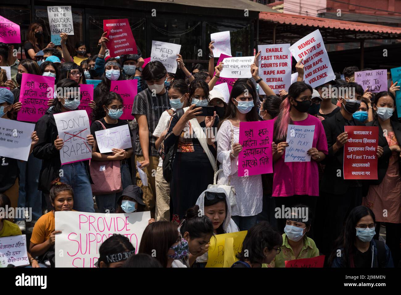 Kathmandu, Nepal. 21st May, 2022. Youths hold placards expressing their ...