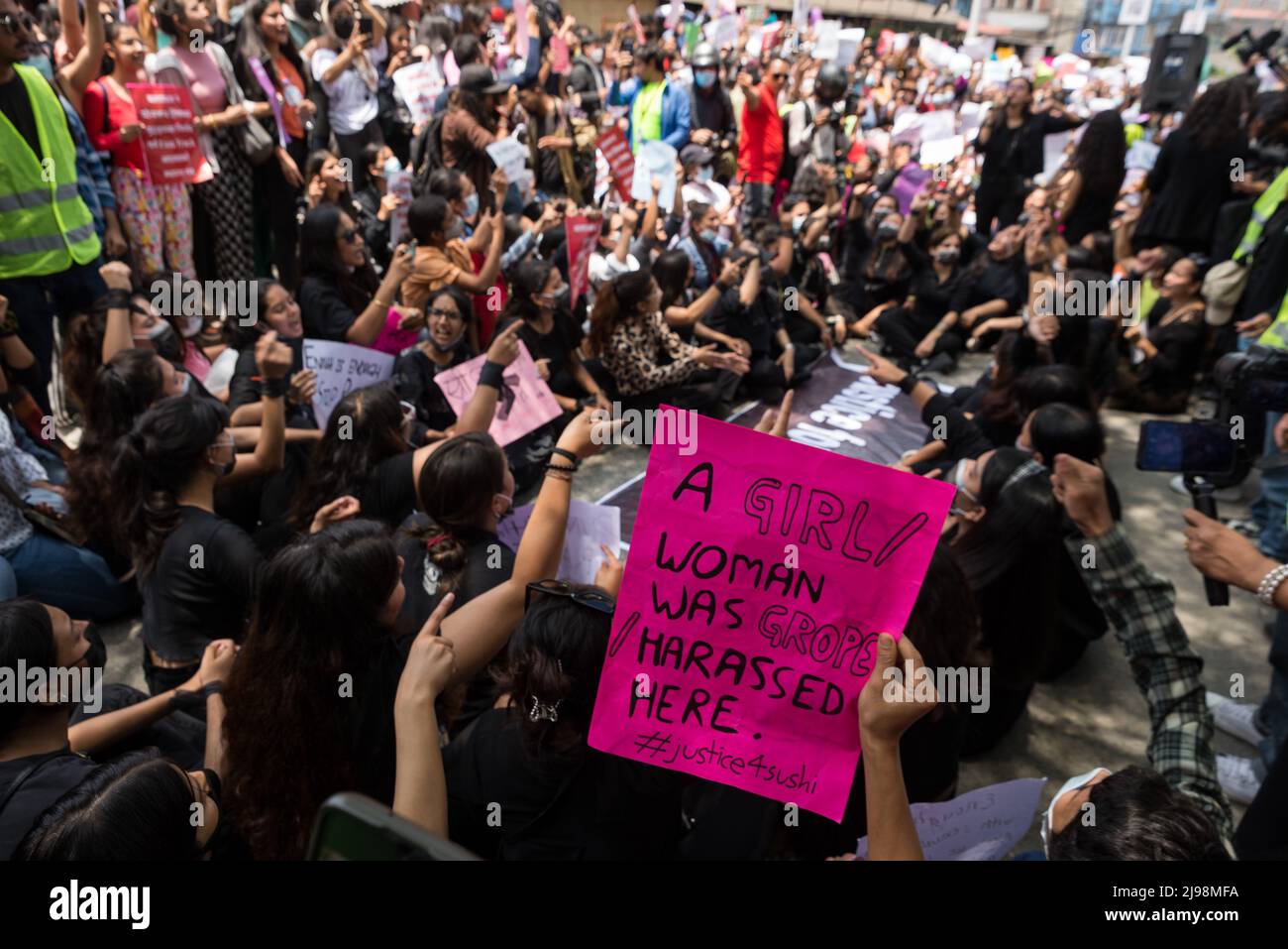 Kathmandu, Nepal. 21st May, 2022. A youth holds a placard while ...