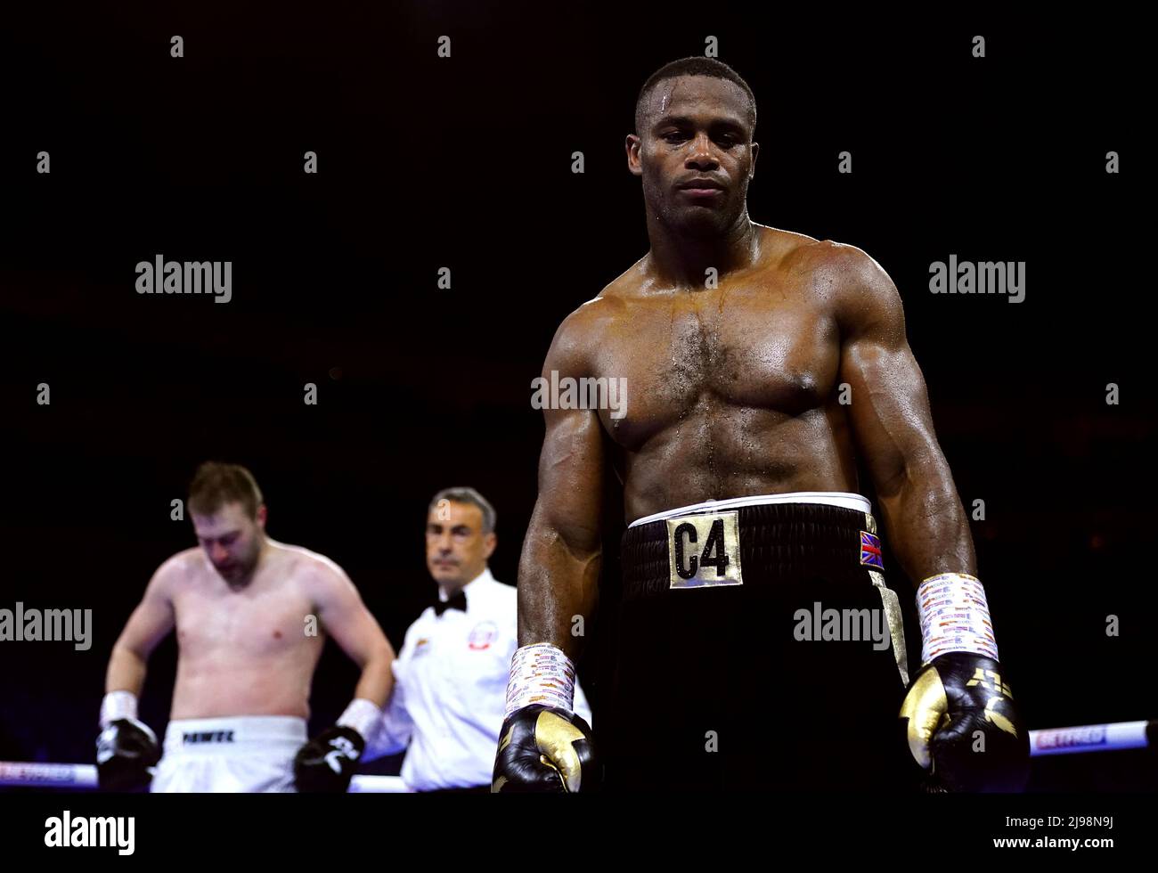 Cheavon Clarke (right) celebrates victory against Pawel Martyniuk in ...