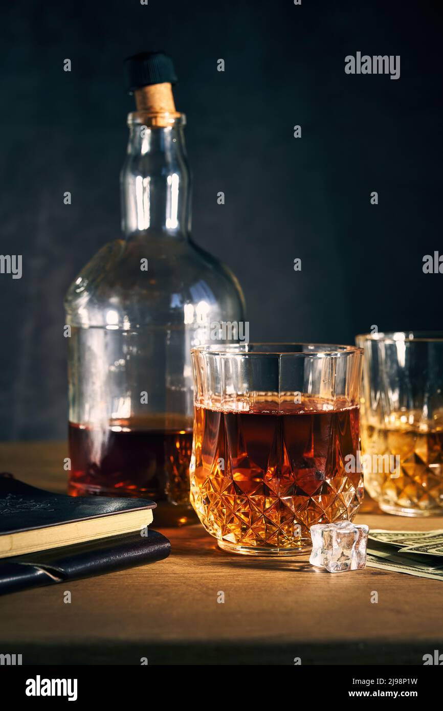 two glasses of whiskey and a bottle Stock Photo - Alamy