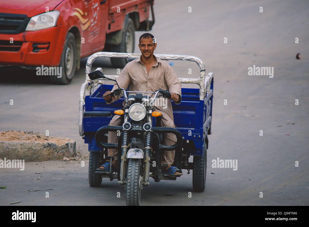 Egyptian man with children on street hi-res stock photography and ...