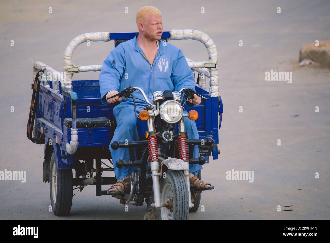 Egyptian man with children on street hi-res stock photography and ...