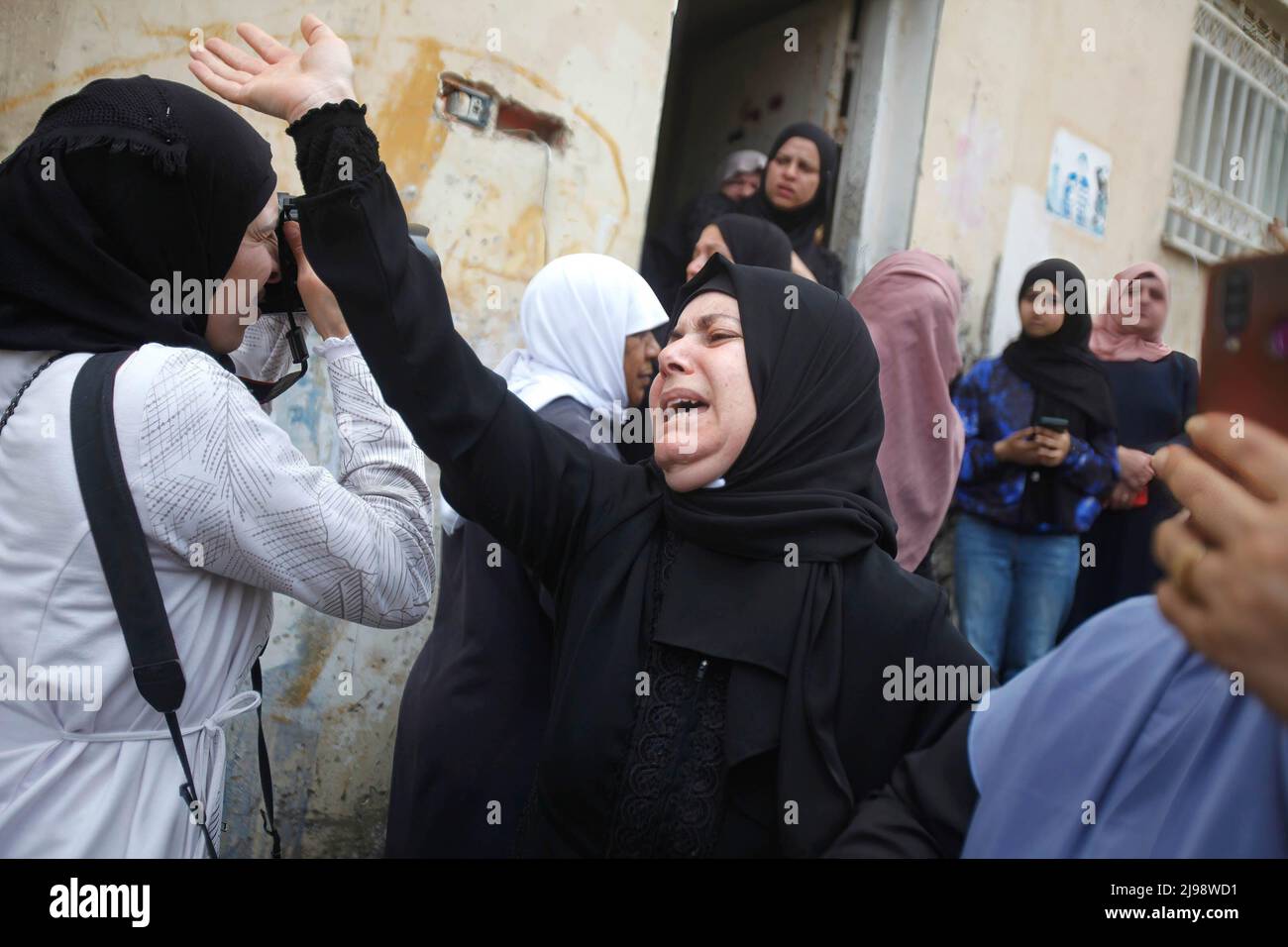 Relatives of 17-year-old Palestinian Amjad Al-Fayed mourn during his ...