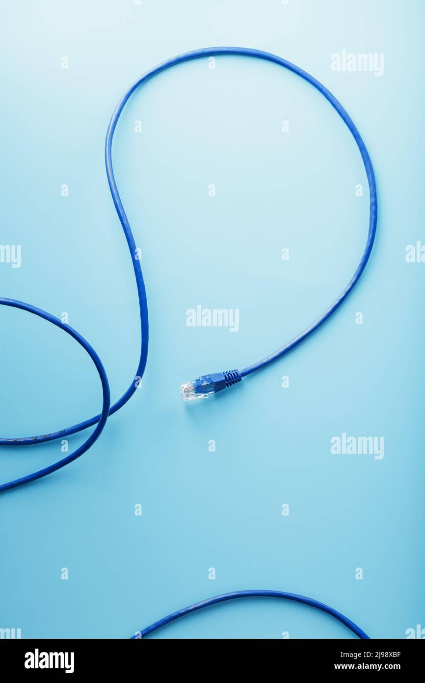 Blue UTP Internet Cable - Isolated on a blue background Ethernet Cord ...