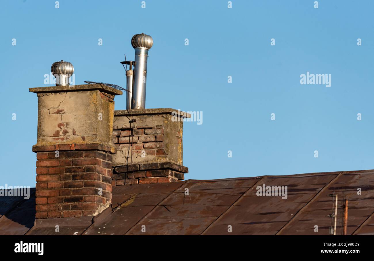 Chimney on the roof of the building. Vent and smoke chimney, smoke ...