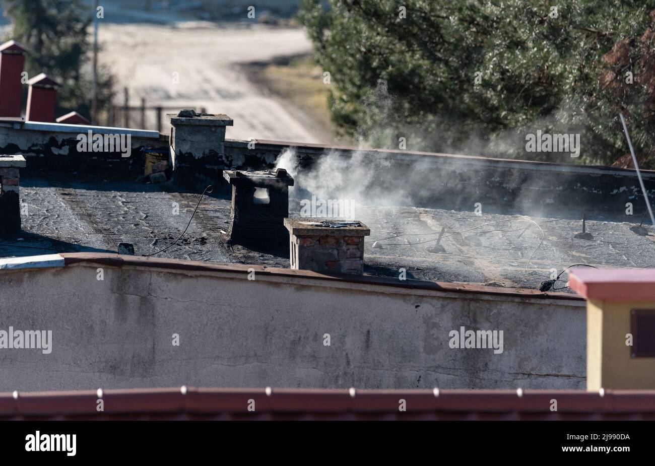 Chimney on the roof of the building. Vent and smoke chimney, smoke ...
