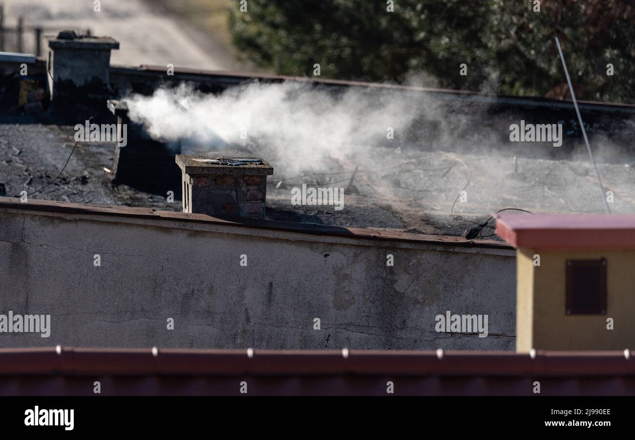 Chimney on the roof of the building. Vent and smoke chimney, smoke ...