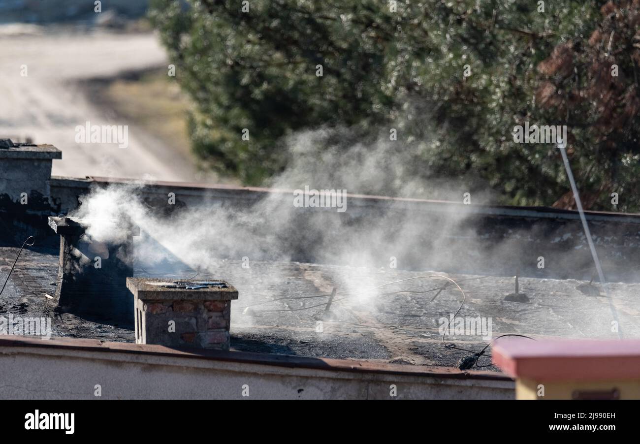 Chimney on the roof of the building. Vent and smoke chimney, smoke ...