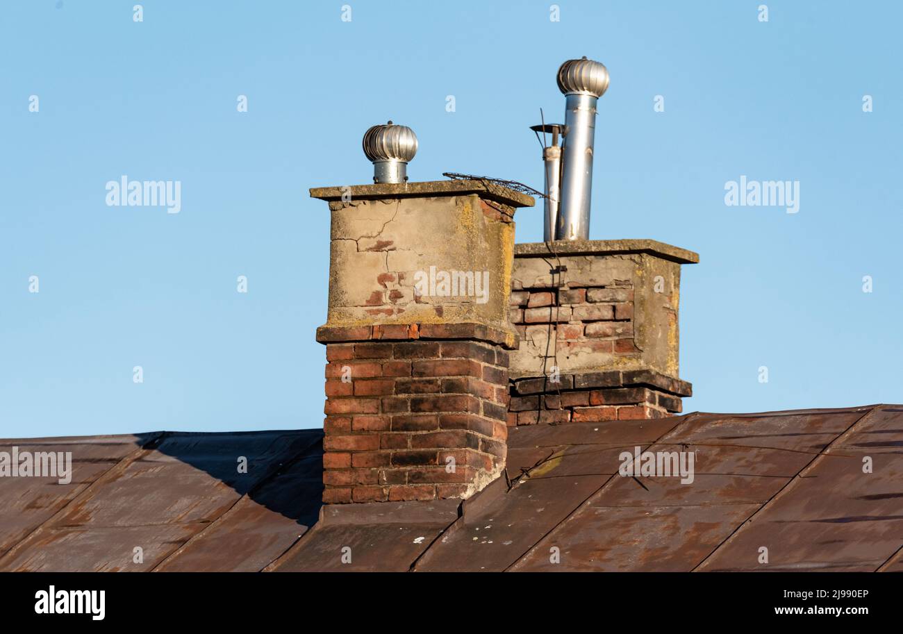 Chimney on the roof of the building. Vent and smoke chimney, smoke ...
