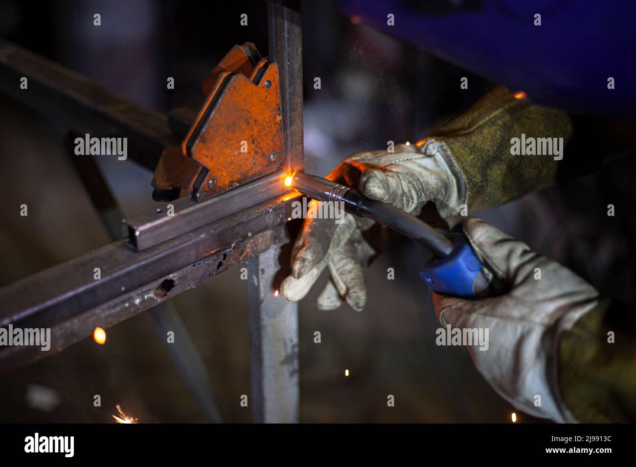 Metal welding. Fire from operation of welding machine. Manufacture of ...