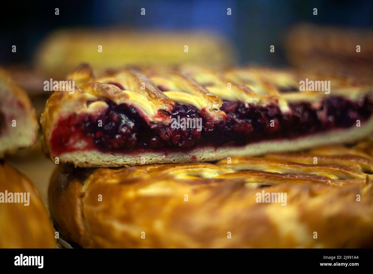 The stuffed pie is cooked in the oven. Tasty food made of dough. Do-it ...