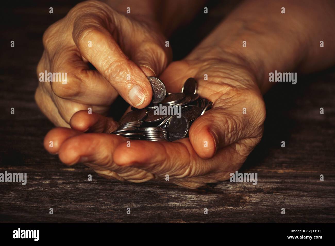 Old coin hands hi-res stock photography and images - Alamy