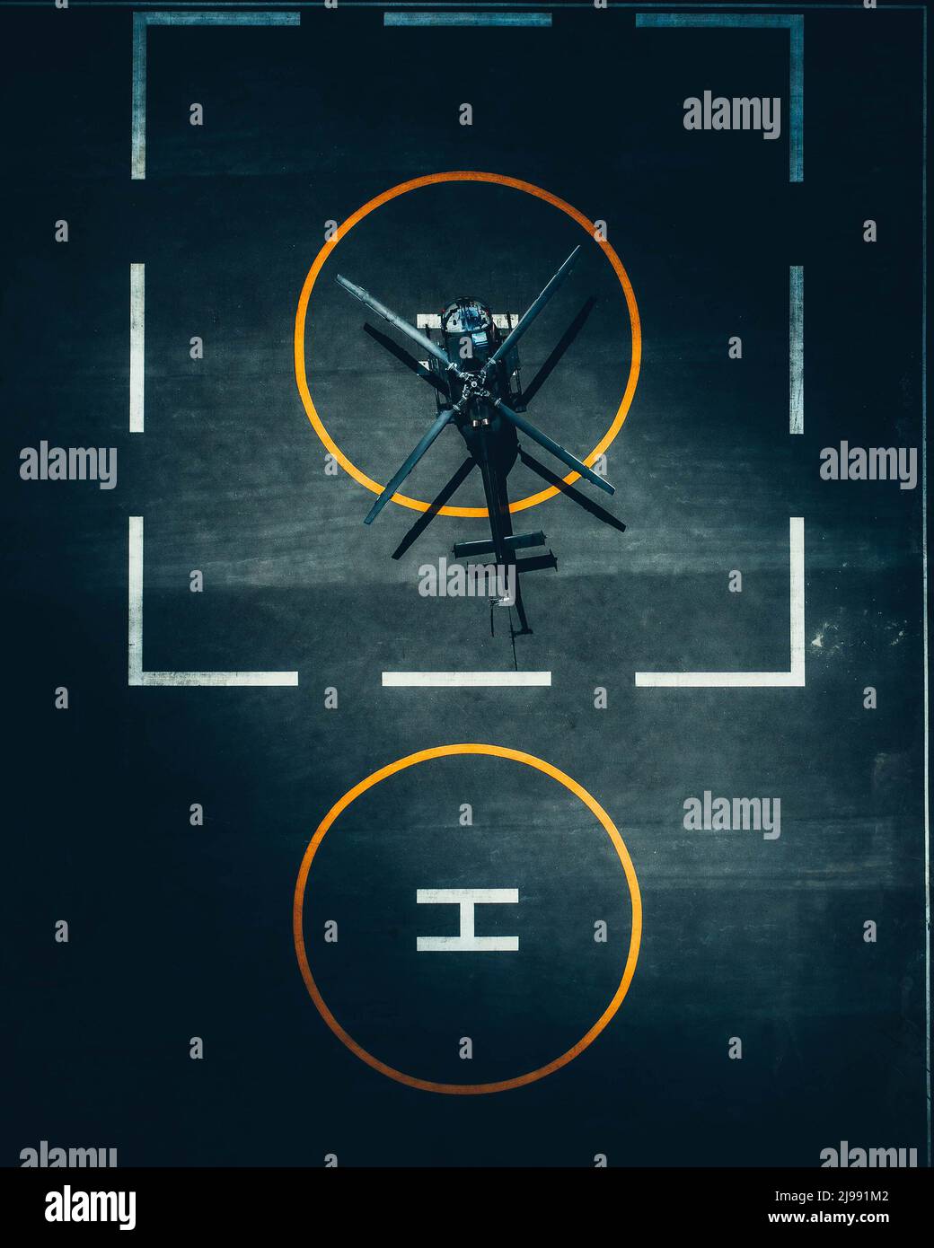 Top view from drone of helicopter standing at helipad Stock Photo - Alamy