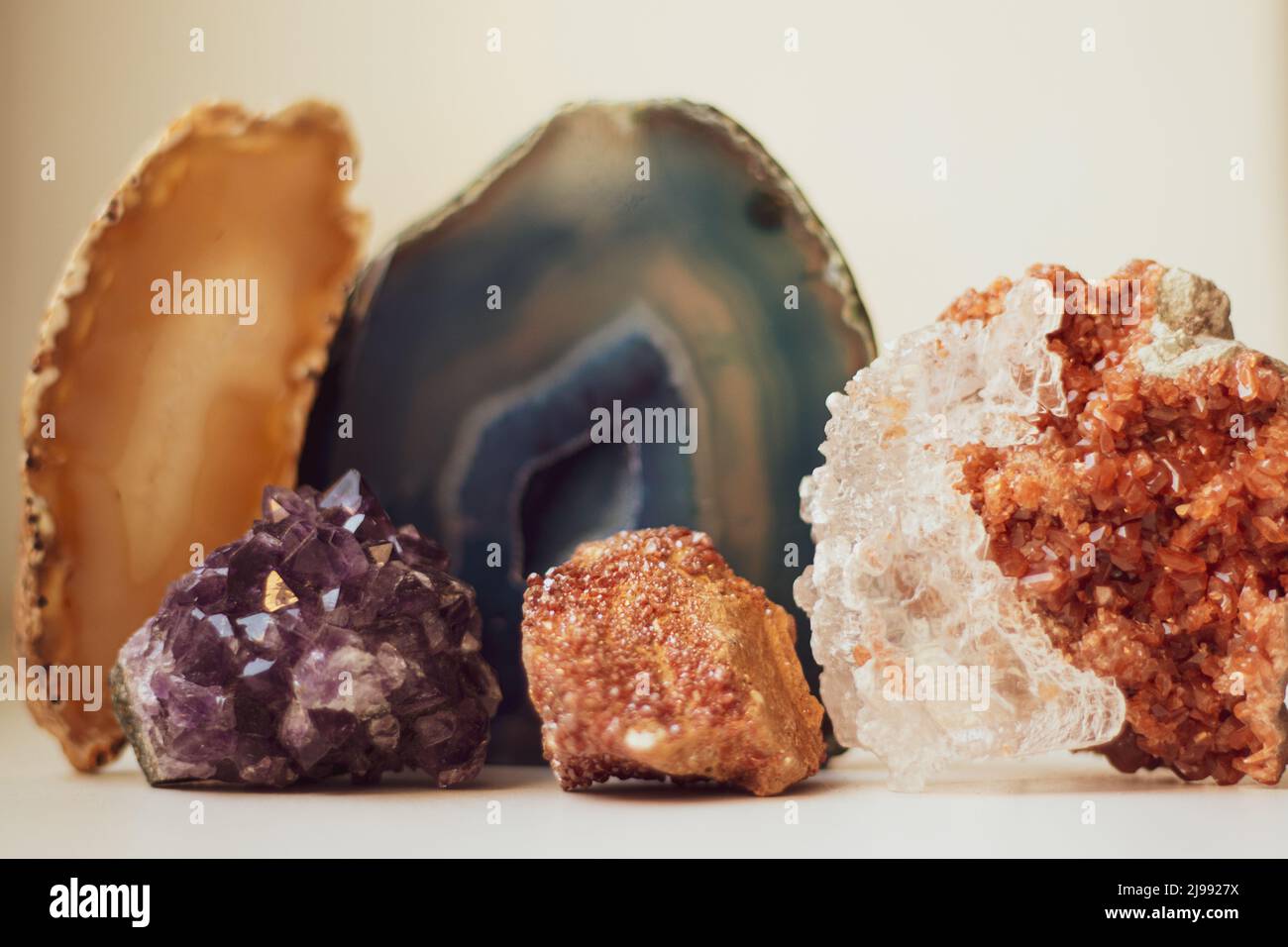 Large blue crystal of agate and druse crystals, cross section isolated ...