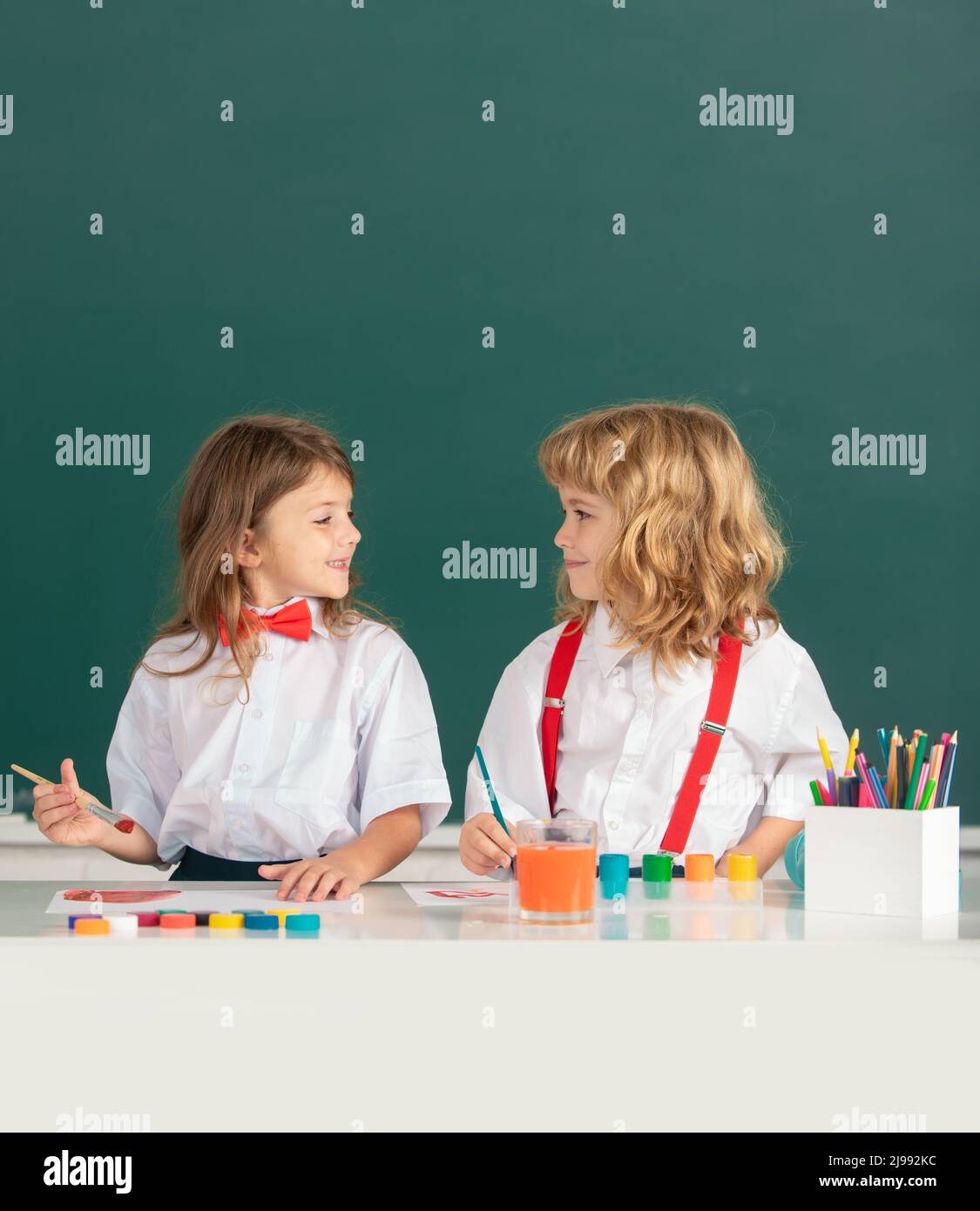 Kids early arts and crafts education. Portrait school kids doing art ...