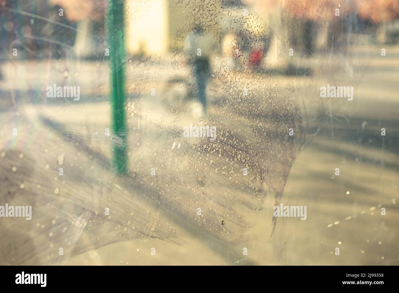 Scratched mirror. Damaged surface of glass. Dirt in display case ...