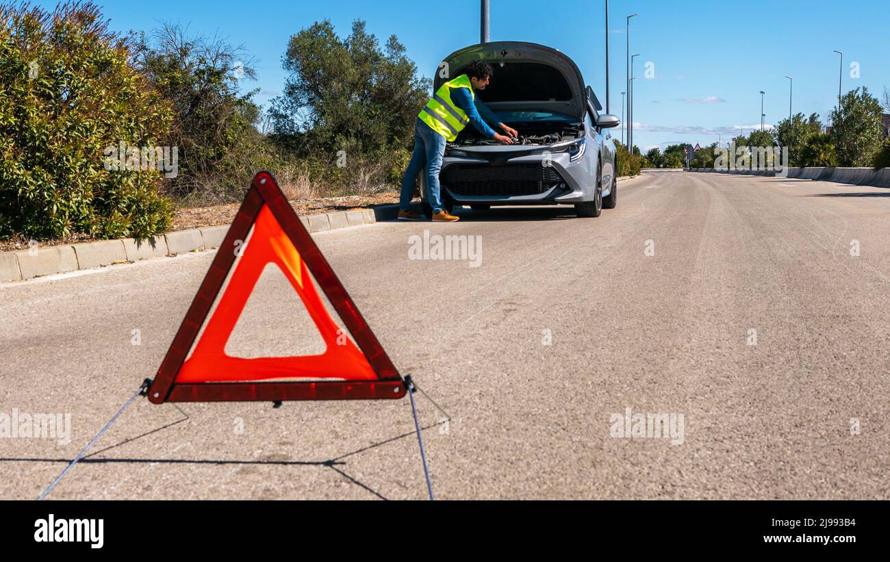 Car standing near stop sign hi-res stock photography and images - Alamy