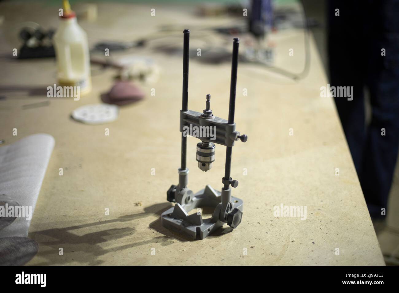 Hand drill on table. Tools in garage. Hole drilling tool. Details of ...