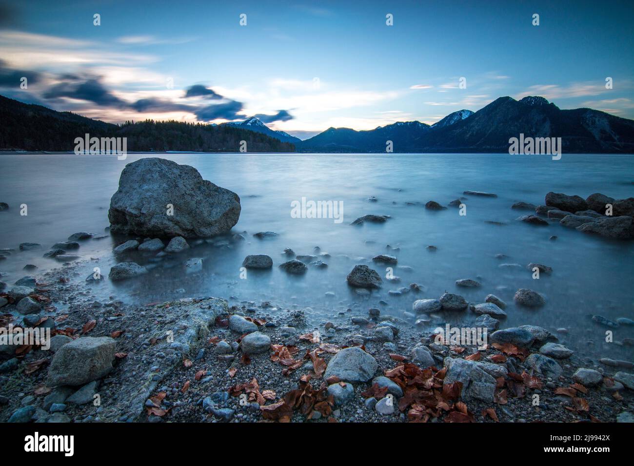 Cloudy water at bavarian lake with winter sun, Walchensee Bavaria Stock ...