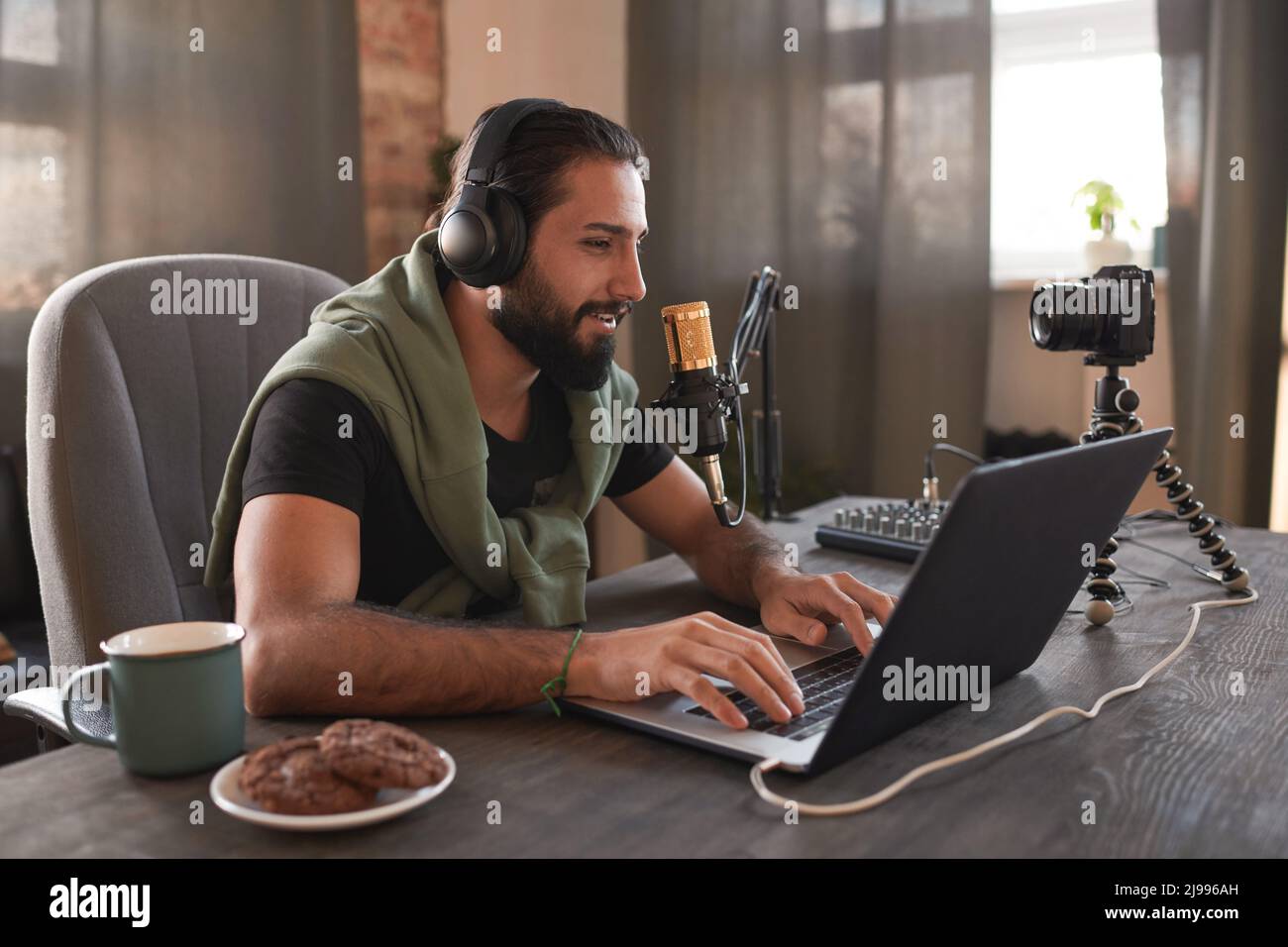 Horizontal medium portrait of handsome bearded young Middle Eastern man ...