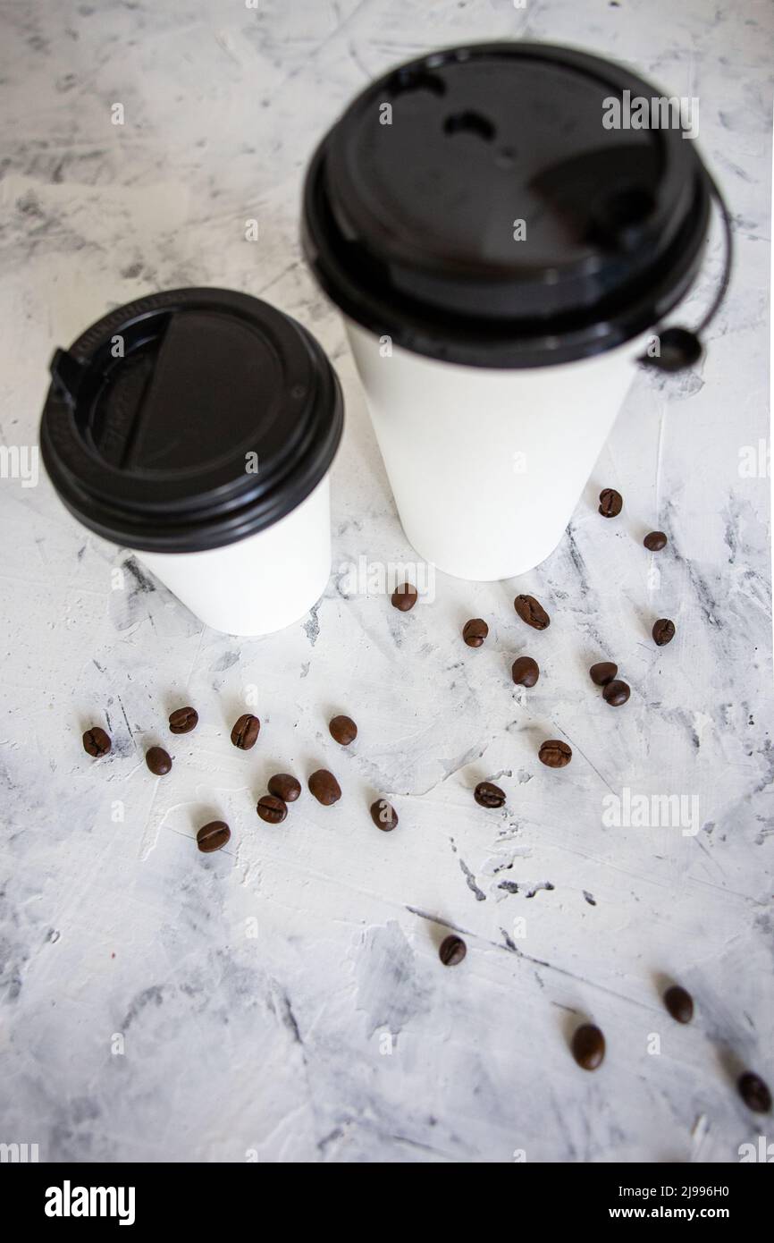 coffee carton cups with beans top view Stock Photo - Alamy