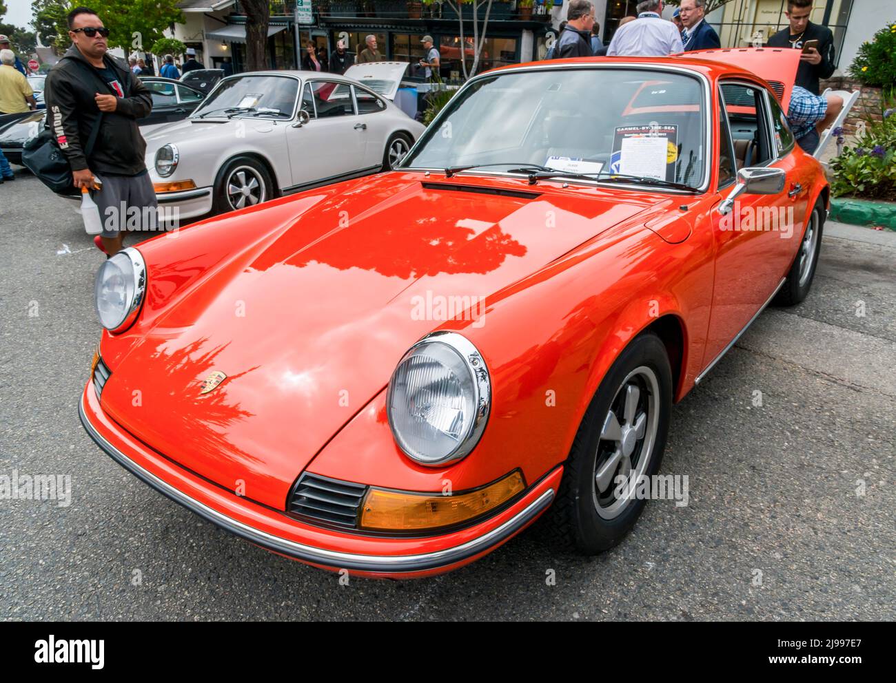 A bright orange Porsche 911 on display at the 2017 Carmel-by-the-Sea ...