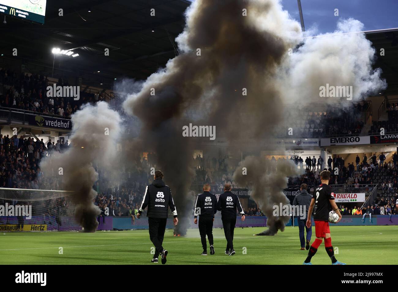 ALMELO - Supporters throw fireworks onto the pitch during the Dutch ...
