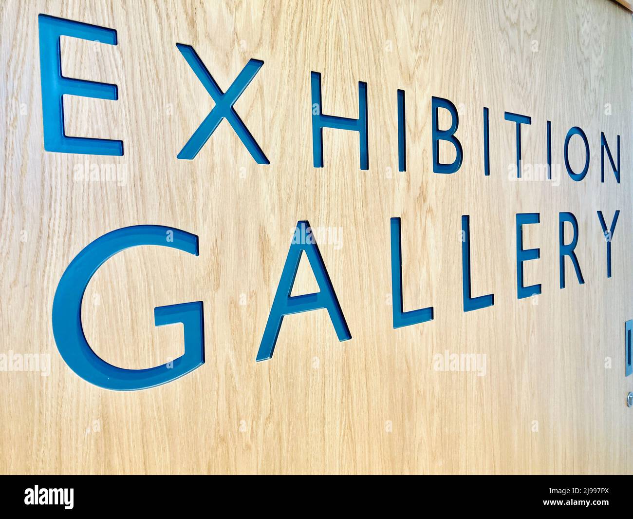 Art gallery exhibition sign on a wooden door Stock Photo - Alamy