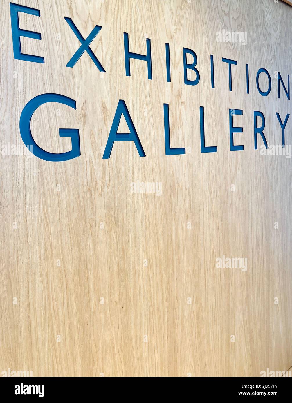 Art gallery exhibition sign on a wooden door Stock Photo - Alamy