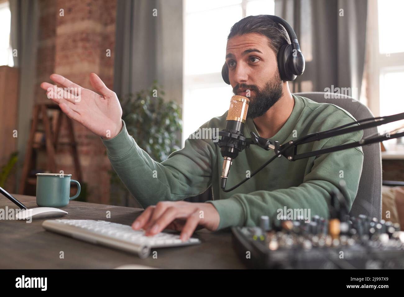 Horizontal medium portrait of handsome young Middle Eastern man wearing ...