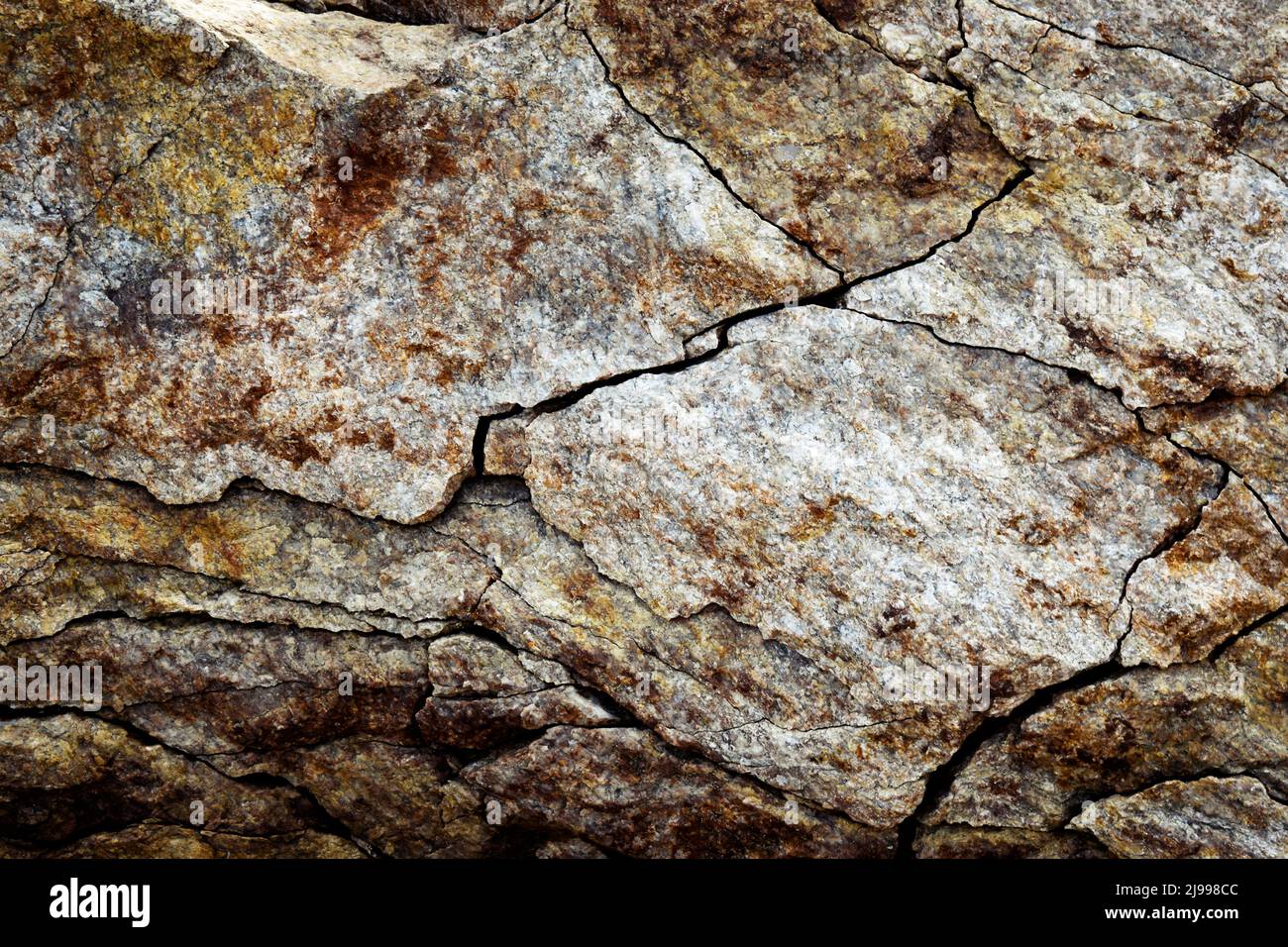 abstract background or texture Cracks on the rock of the block Stock ...