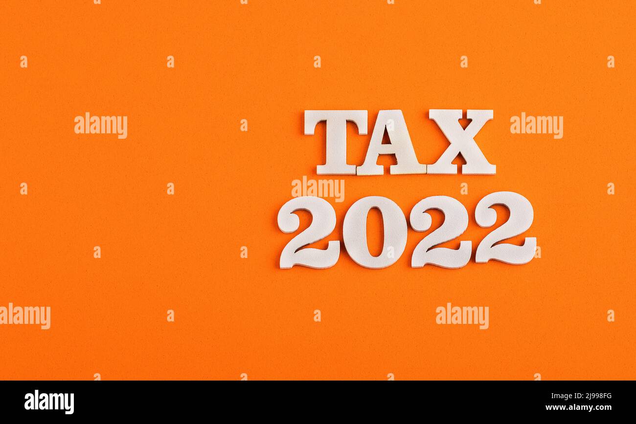 Payment of taxes for the year 2022 - White numbers on orange background ...