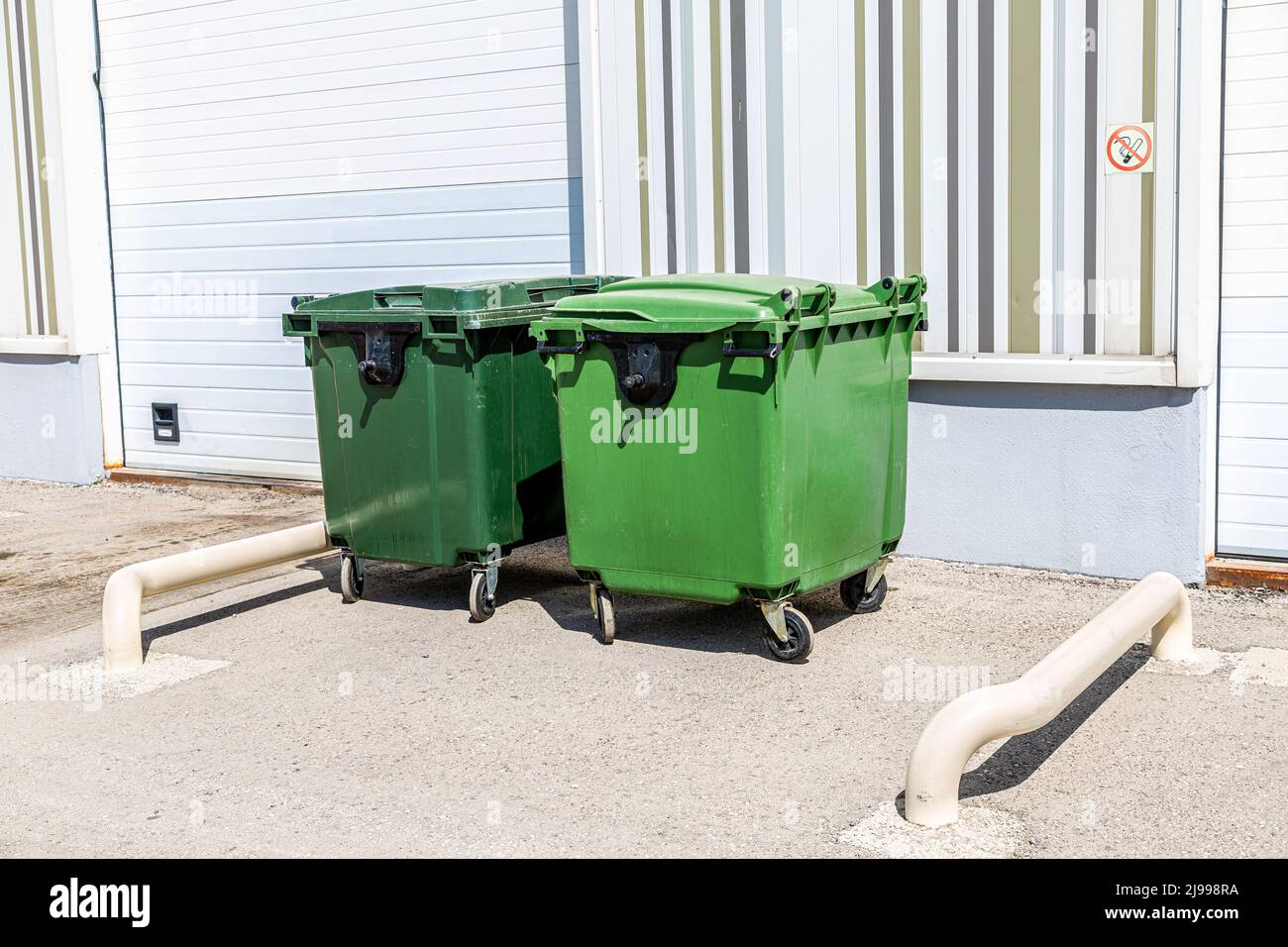 Plastic garbage containers at the city street in summer sunny day Stock ...