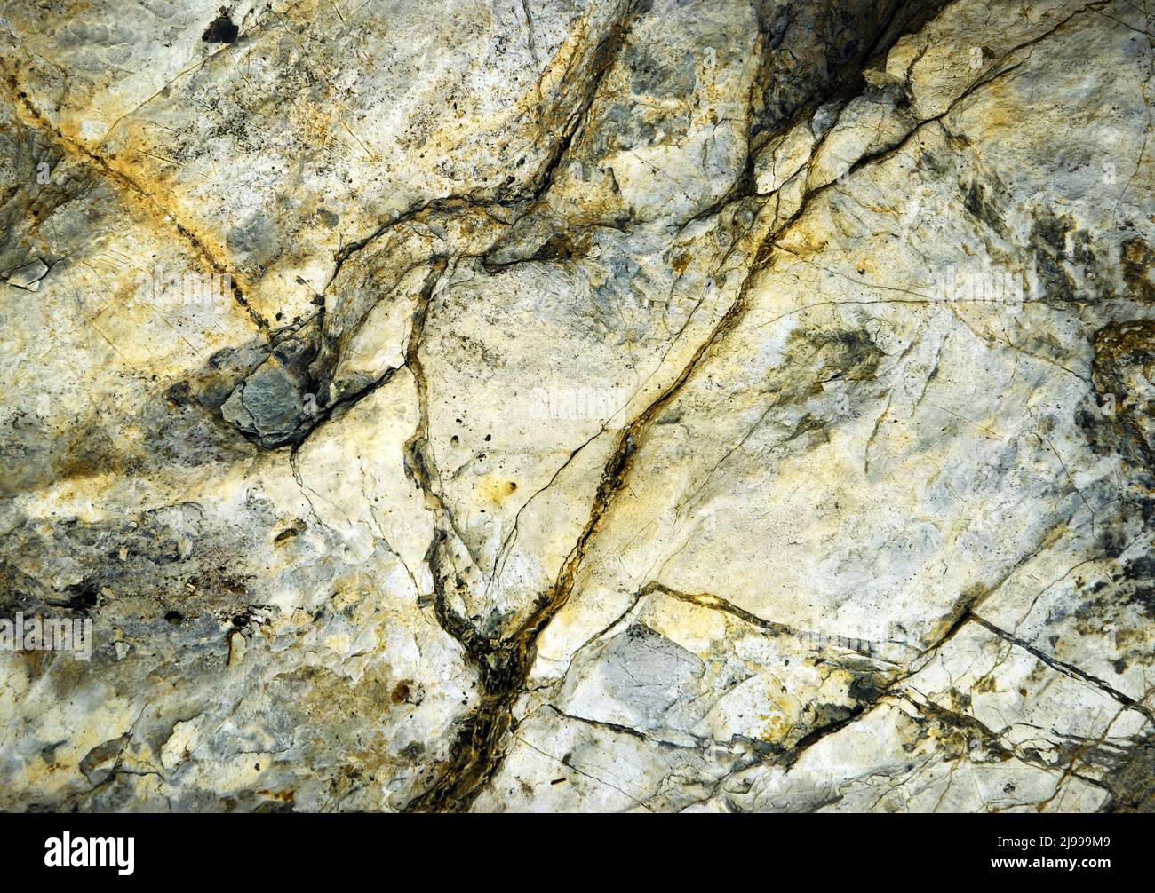 abstract background or texture detail of an old cracked limestone rock ...