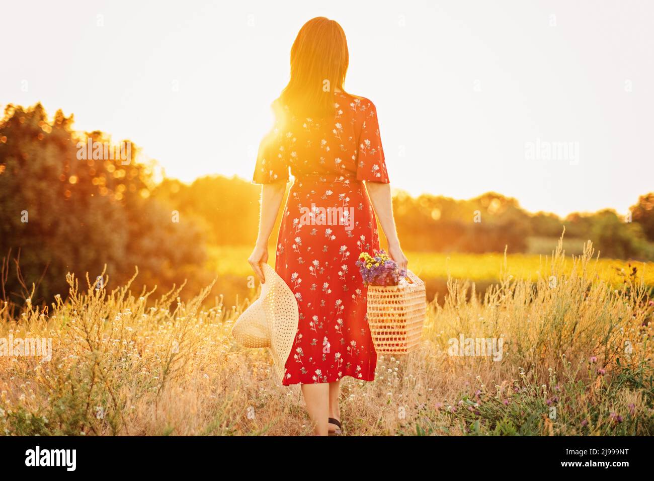 Sun and womens health, vitamin D and summer sun. Back view woman on ...