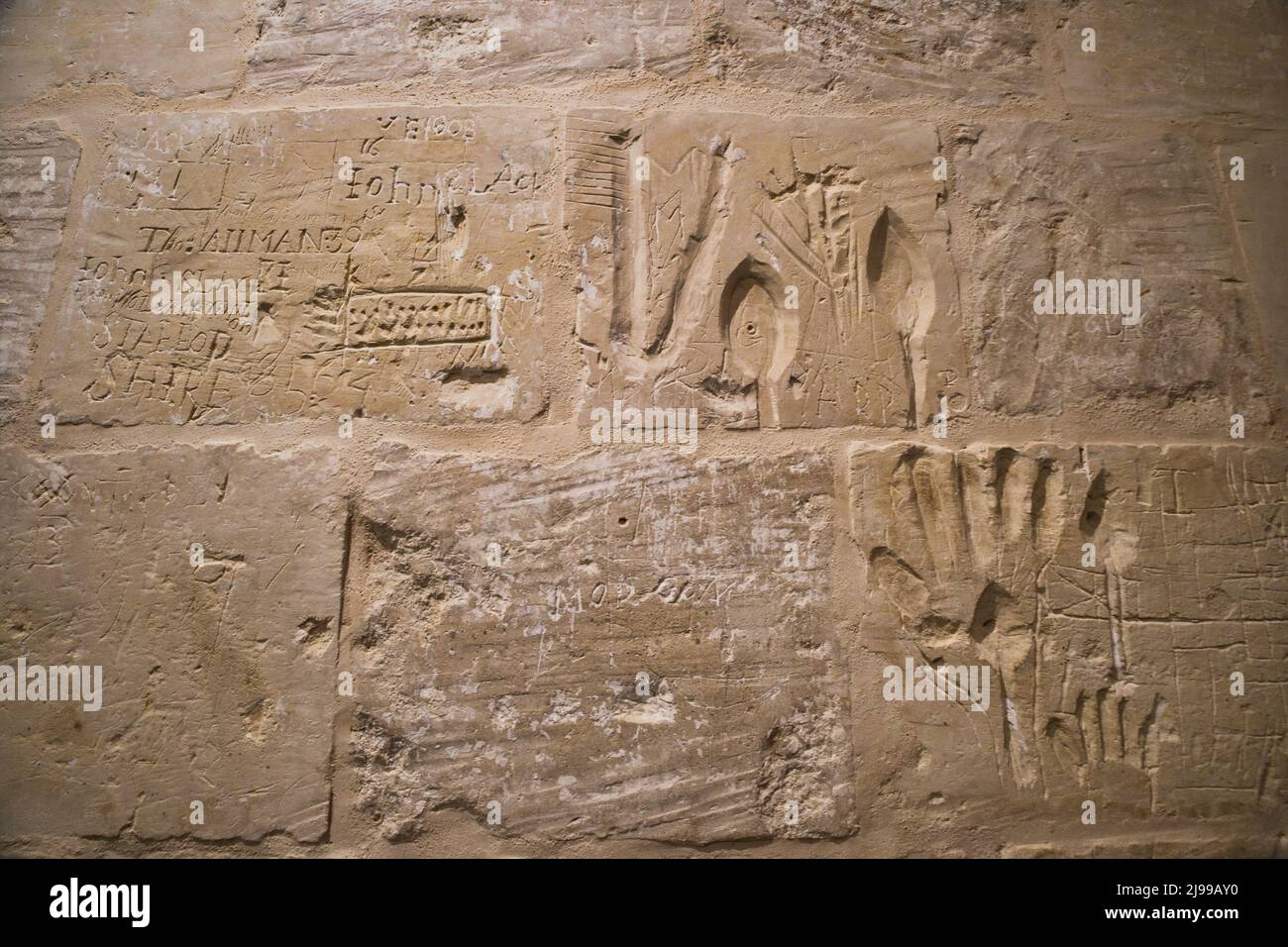 Graffiti on the stone wall of the prison inside the Inquisitor palace ...