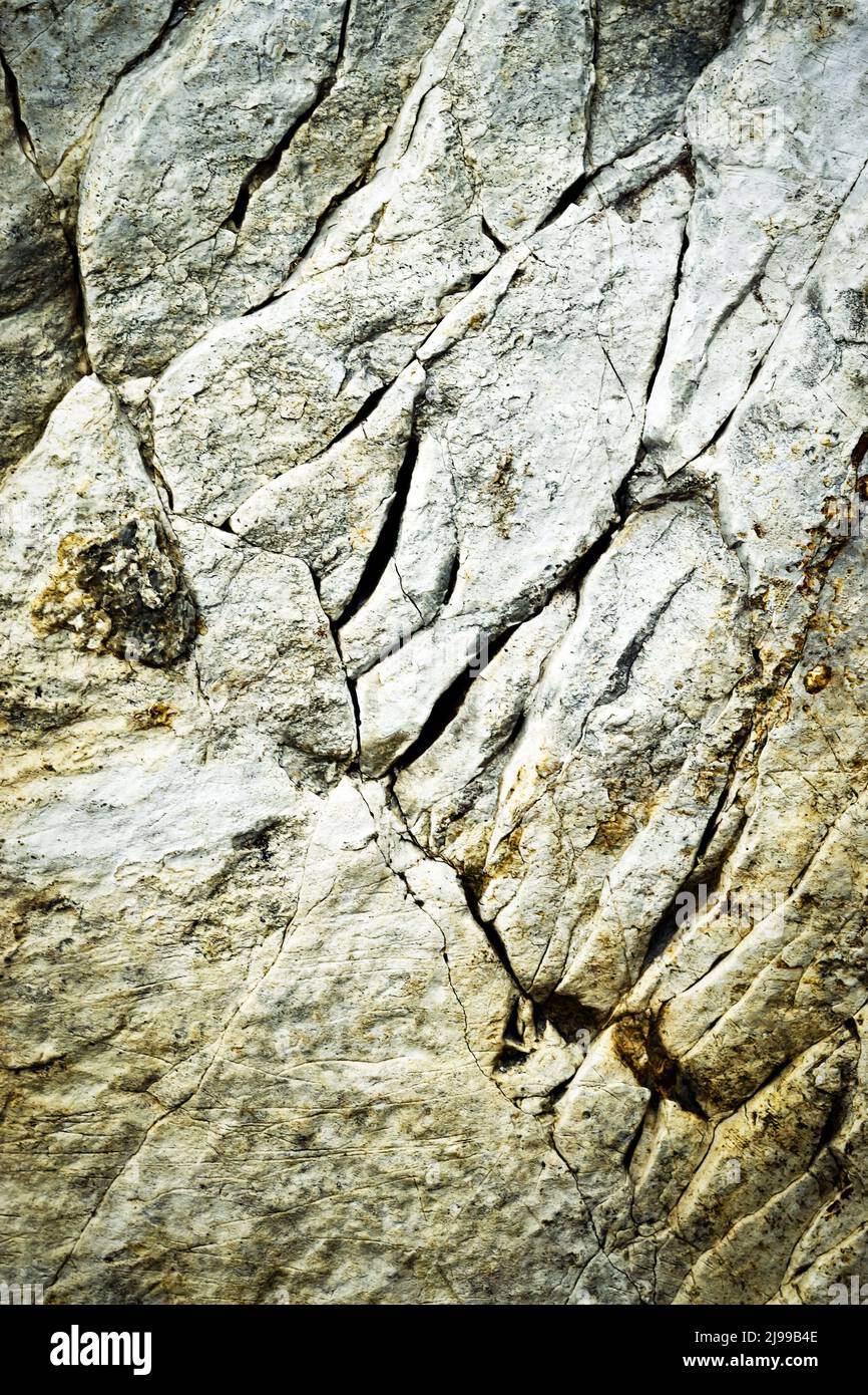 abstract background or texture Detail of old cracked rock limestone ...