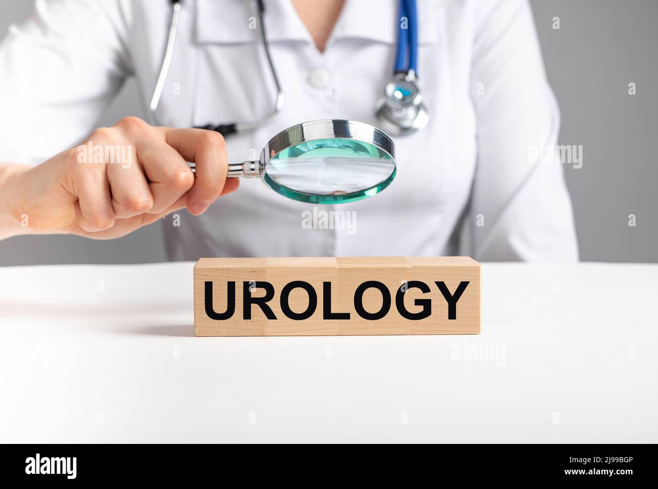 Doctor with magnifying glass checking patient urology. Urologist ...