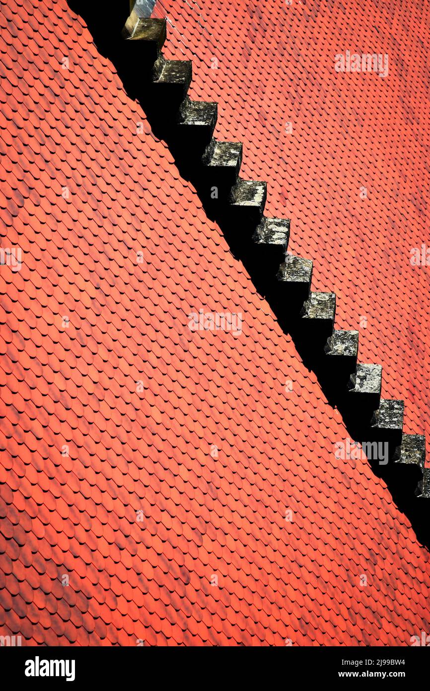 background or texture detail red tiled roof with stairs Stock Photo - Alamy
