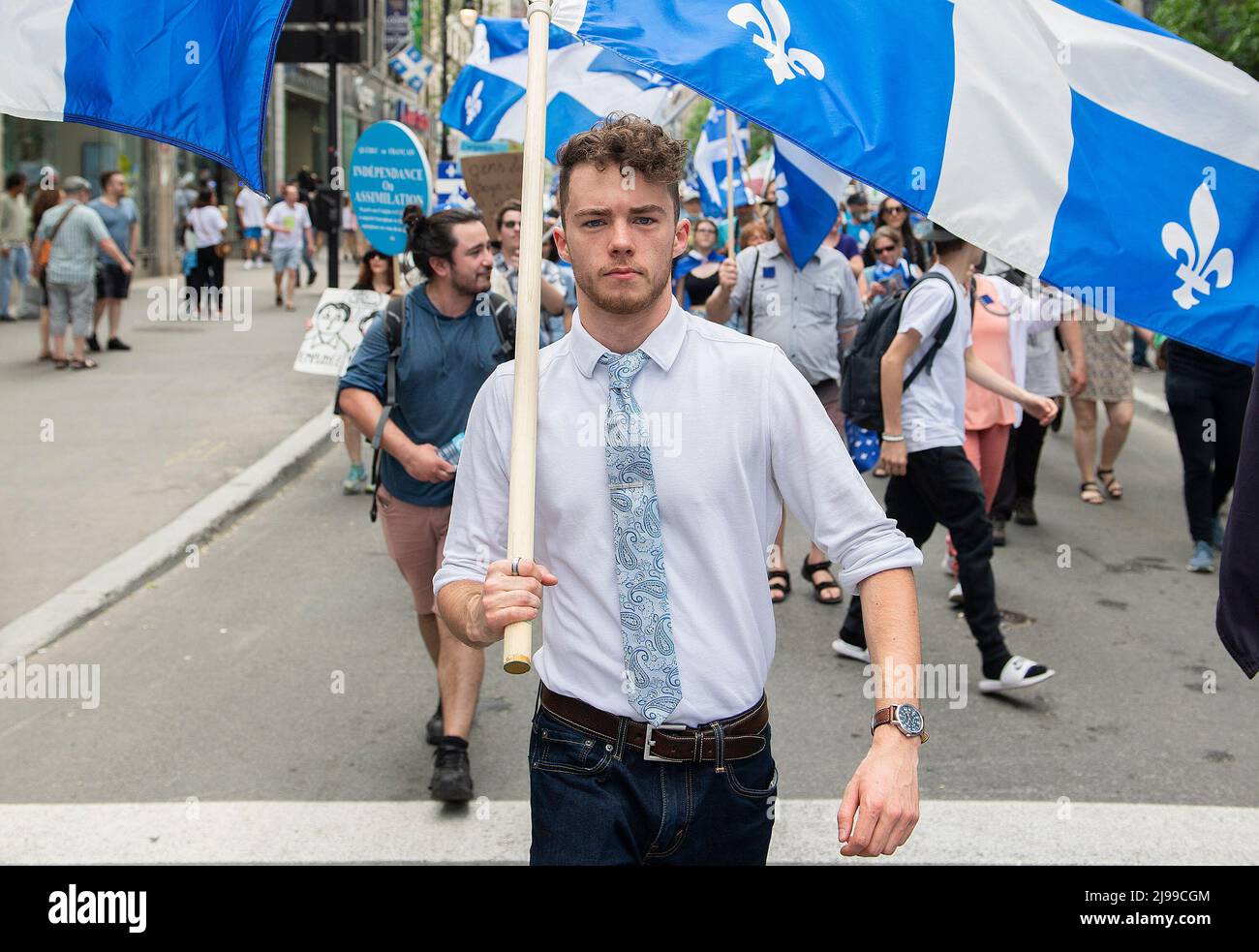 People take part in a march in support of Bill 101 in Montreal ...