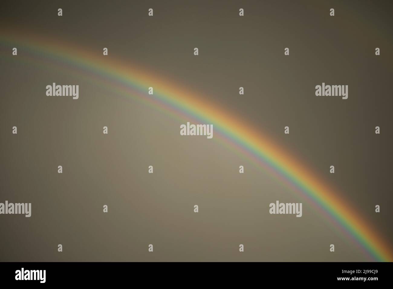 Rainbow in sky. Refraction of light. Weather after rain. Bright arc of ...