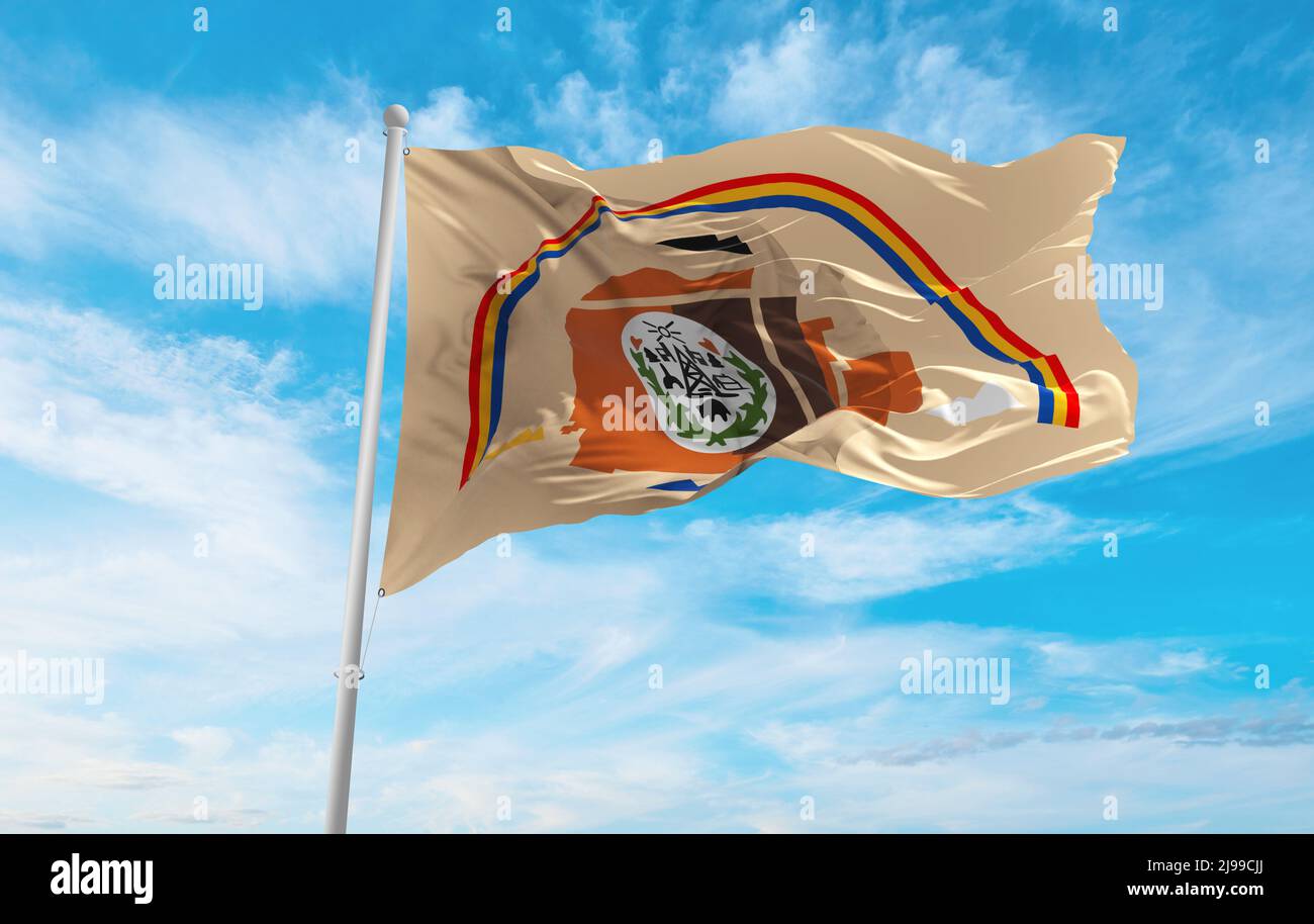 official flag of Navajo people ethnic, USA at cloudy sky background on ...
