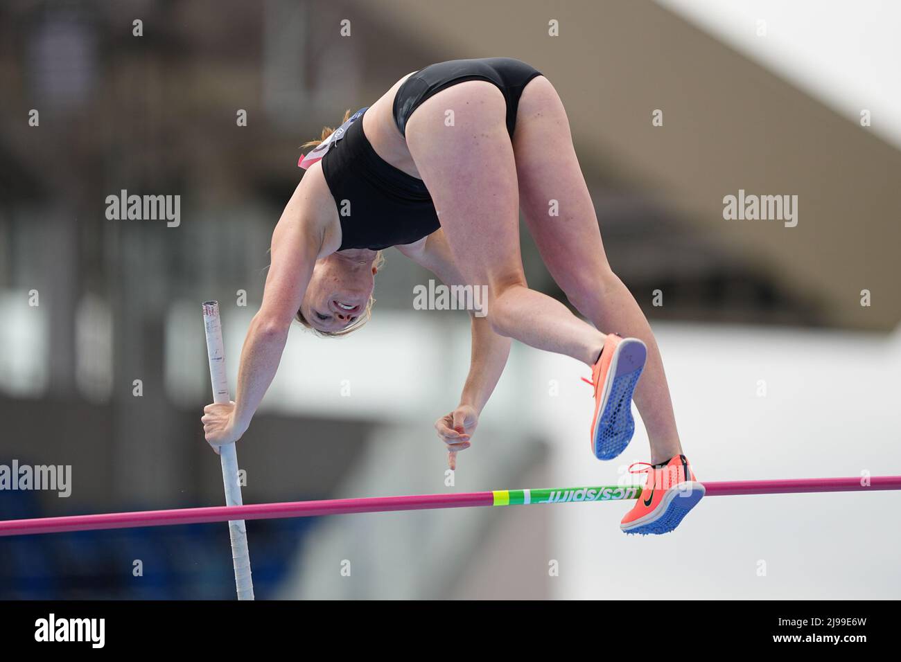 Emily Grove of USA knocks the bar with her foot in the women’s pole ...