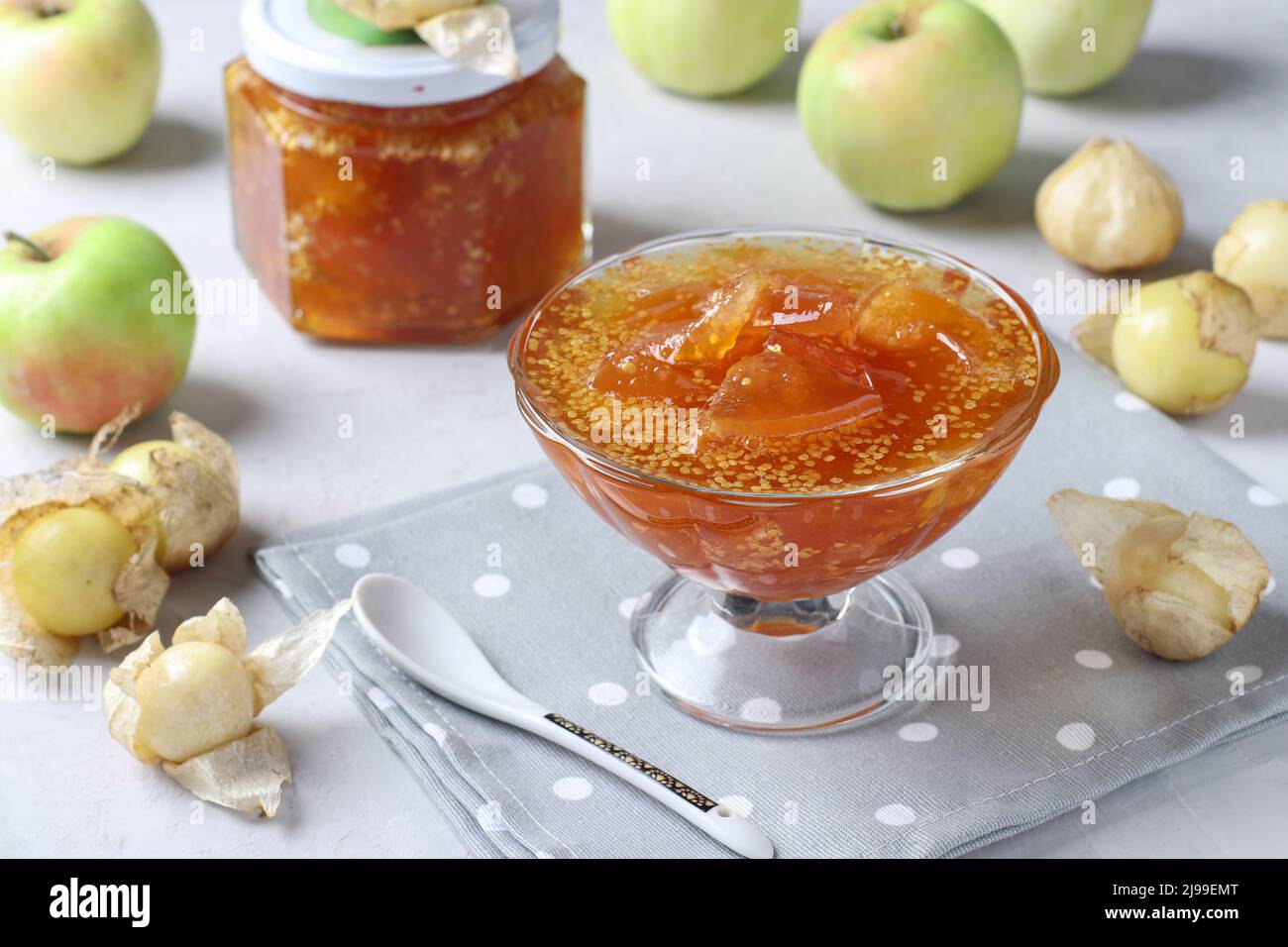 Homemade transparent jam physalis and apples in bowl and glass jar on ...