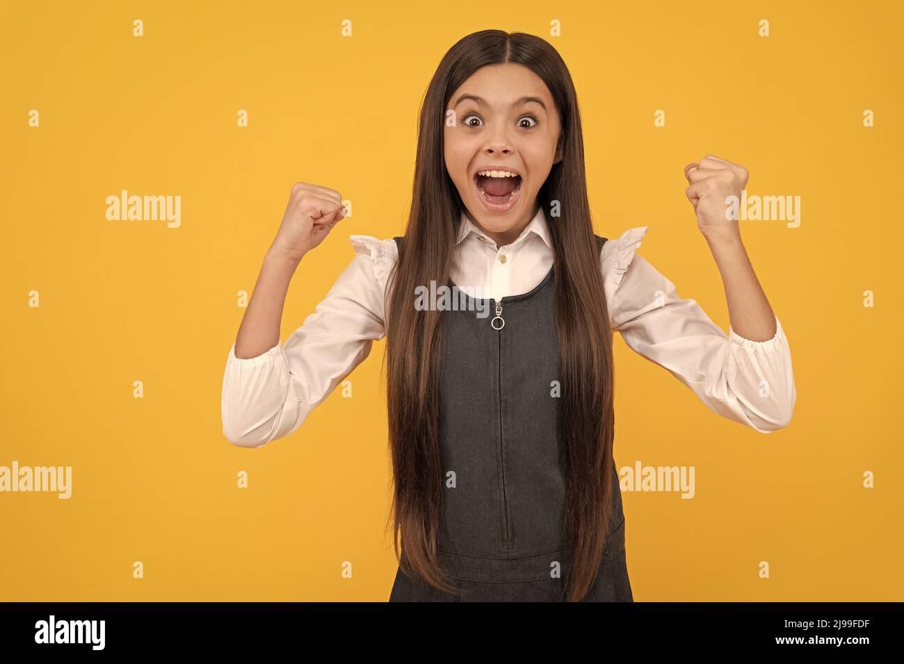 Happy teenage girl winner give winning gesture celebrating victory ...