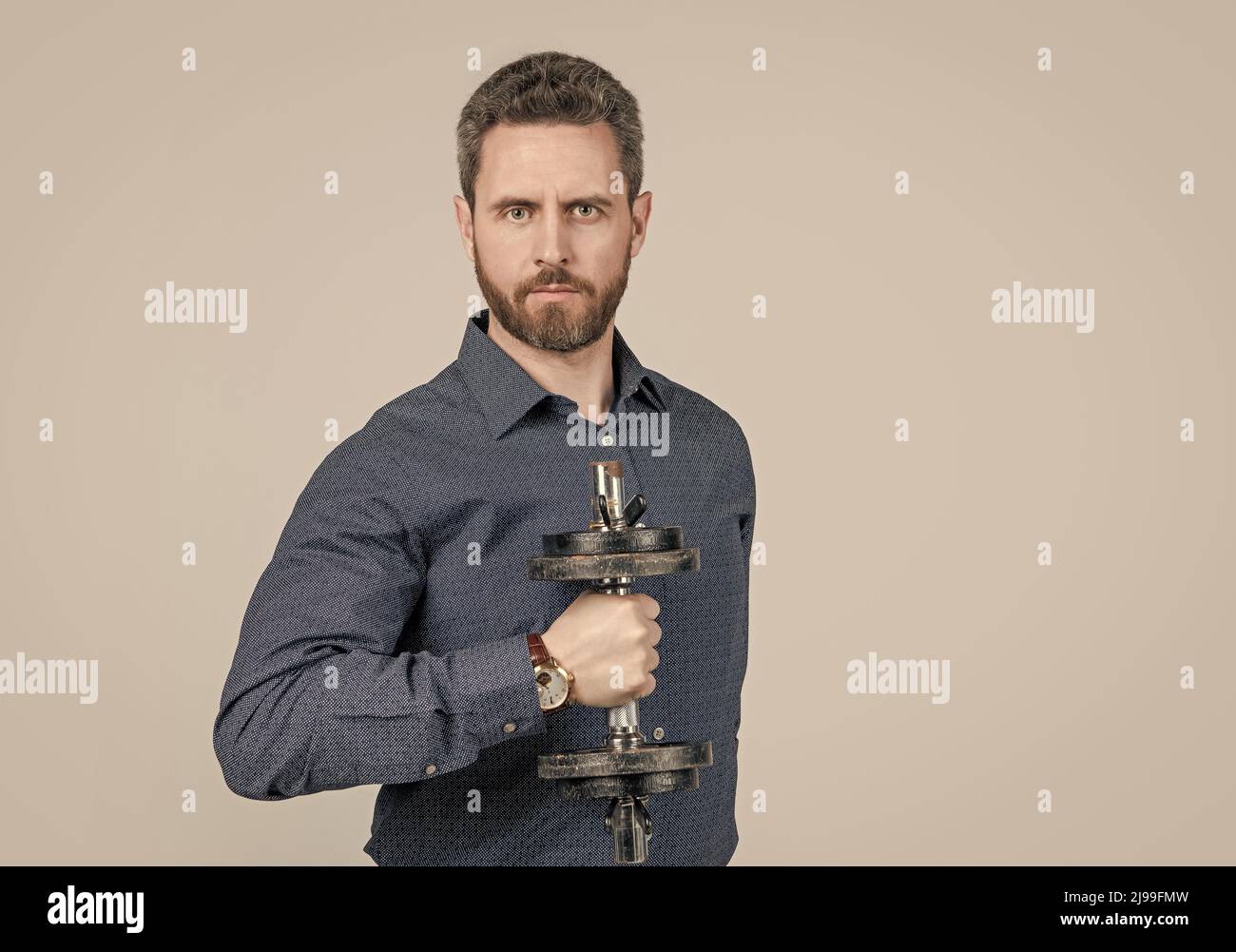 successful strong mature man with beard training with barbells, copy ...