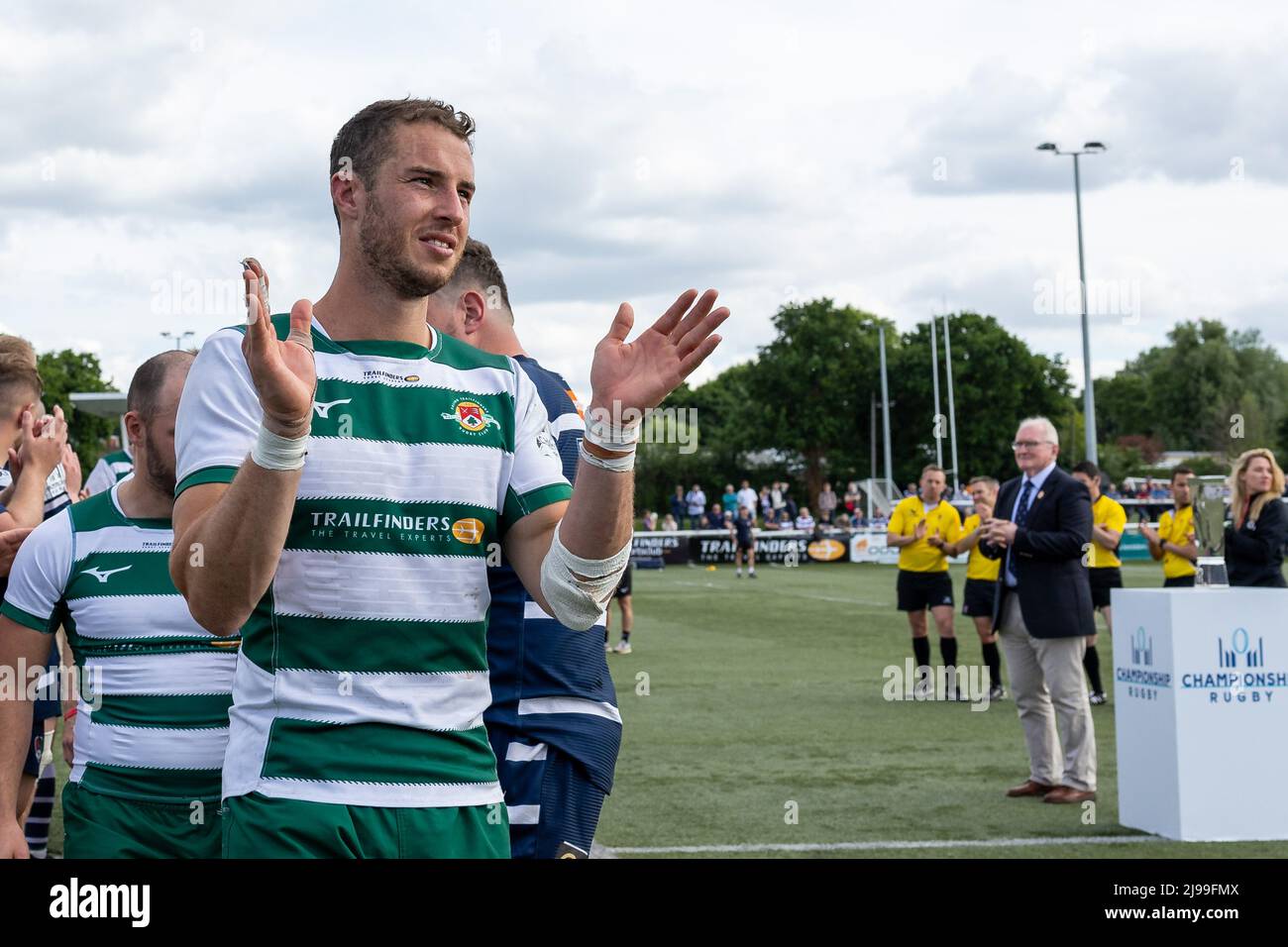 Ealing Trailfinders players walk through a tunnel formed by players ...