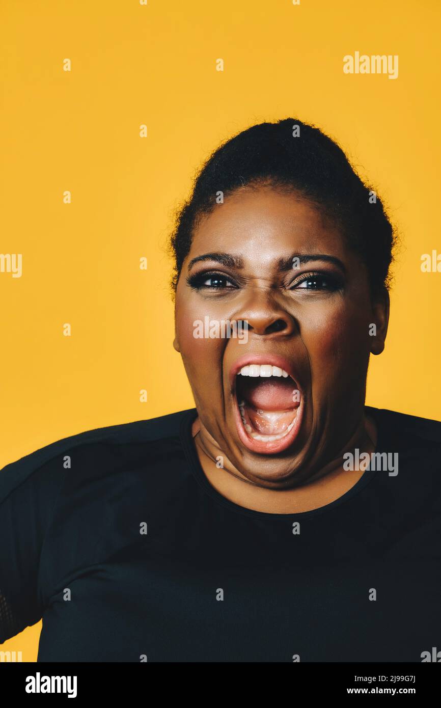 closeup portrait of a young adult african american woman in shock with ...