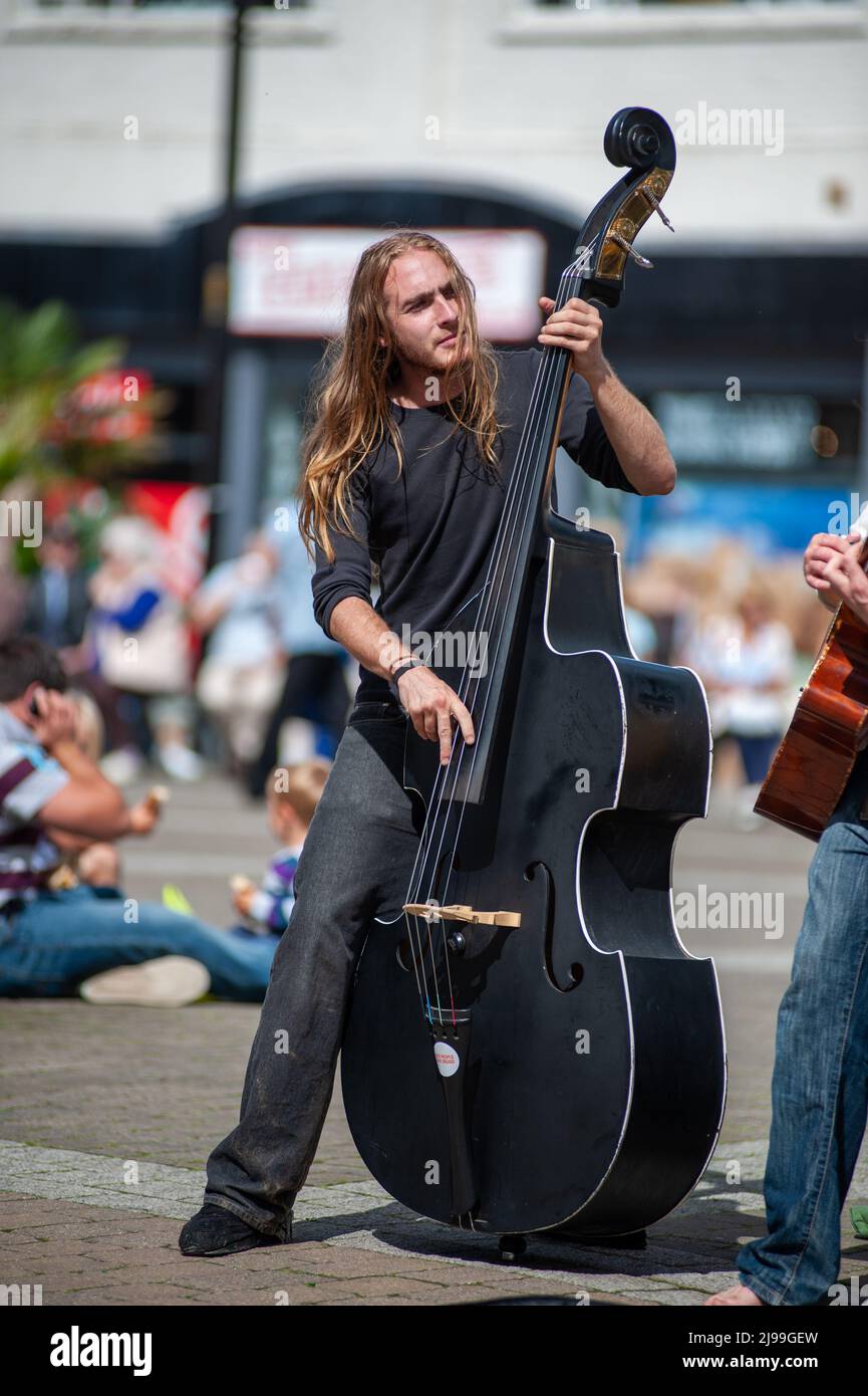 Street busker with a double bass Stock Photo - Alamy